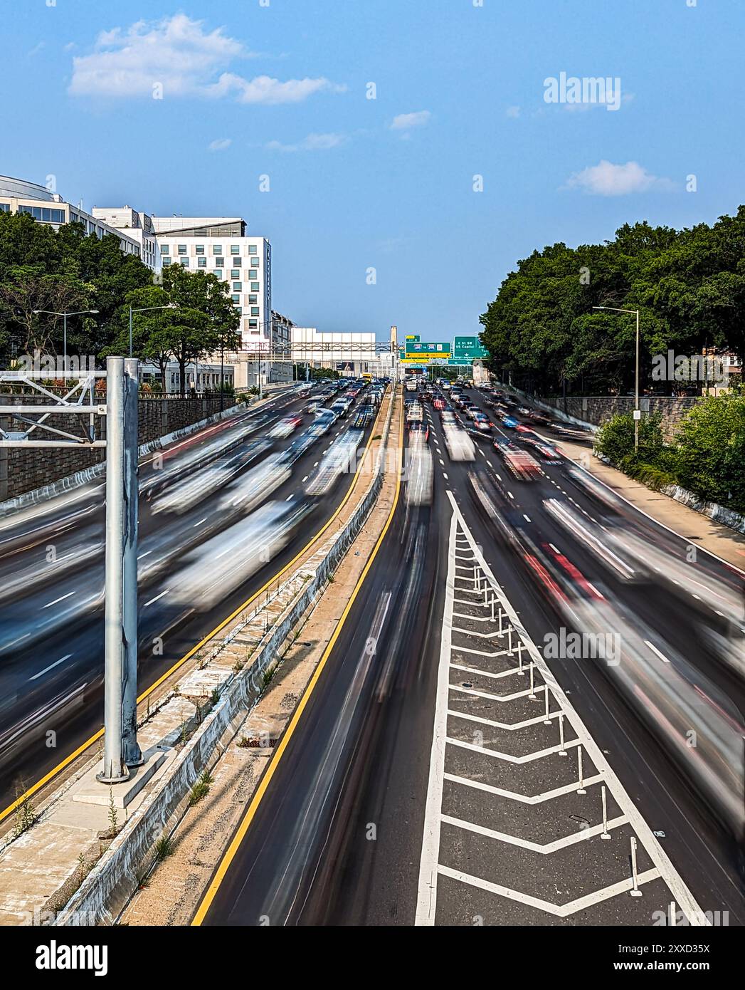 Cars driving down the highway with motion blur effect through rush hour ...
