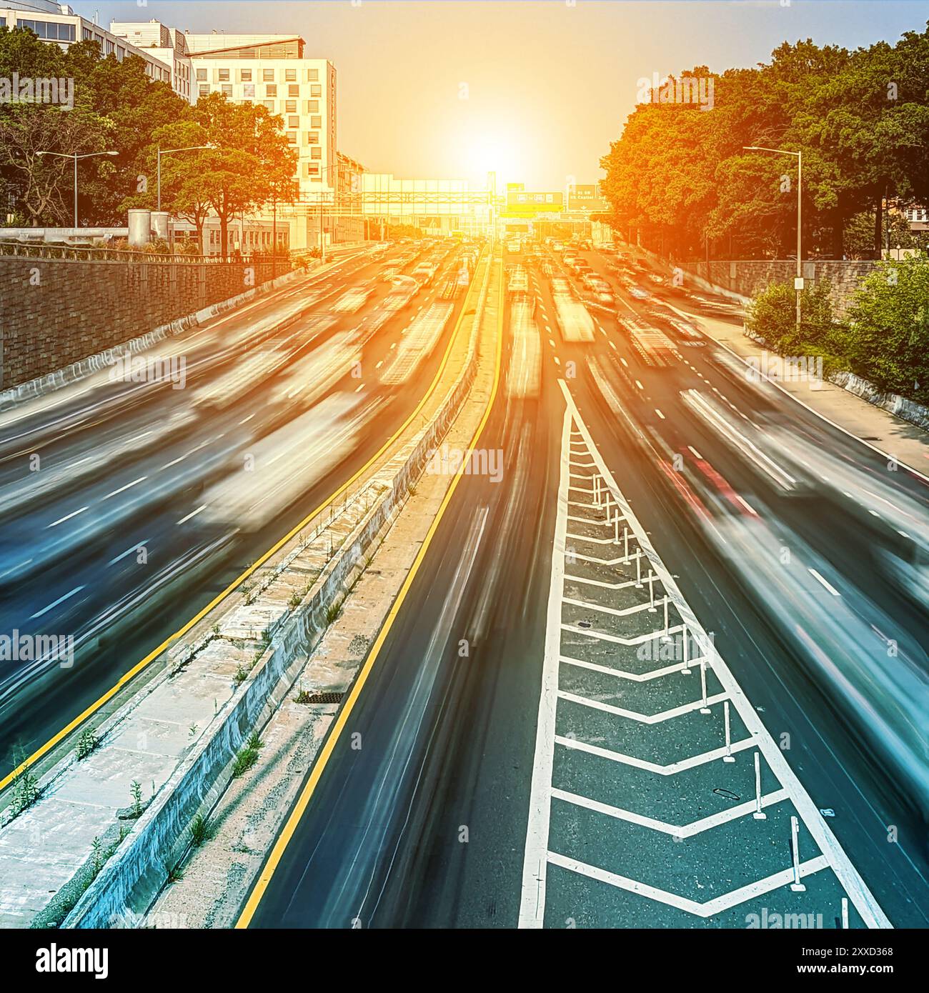 Cars driving down the highway with motion blur effect through rush hour ...