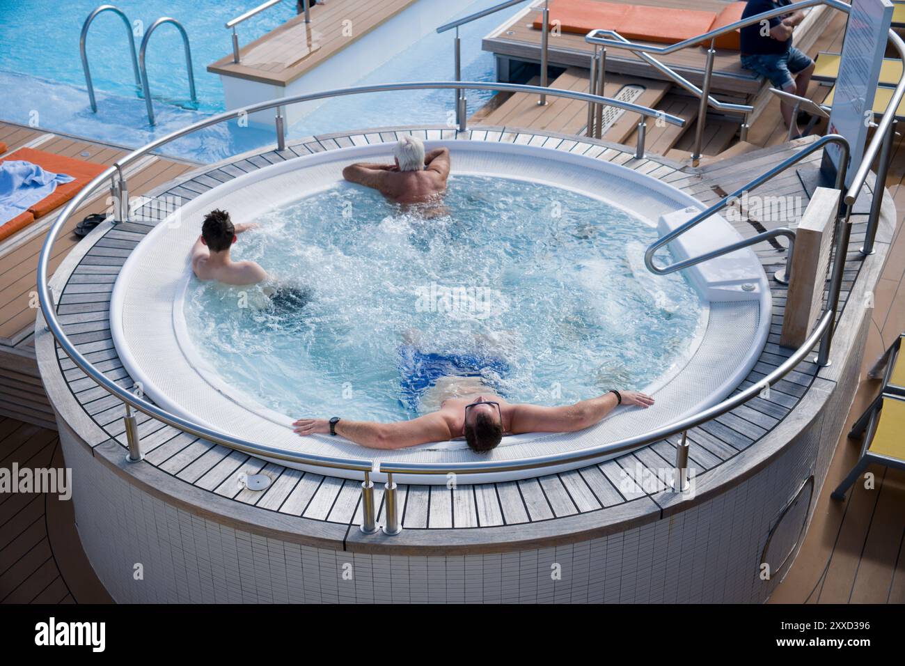 Three men in a whirlpool on a cruise ship Stock Photo - Alamy