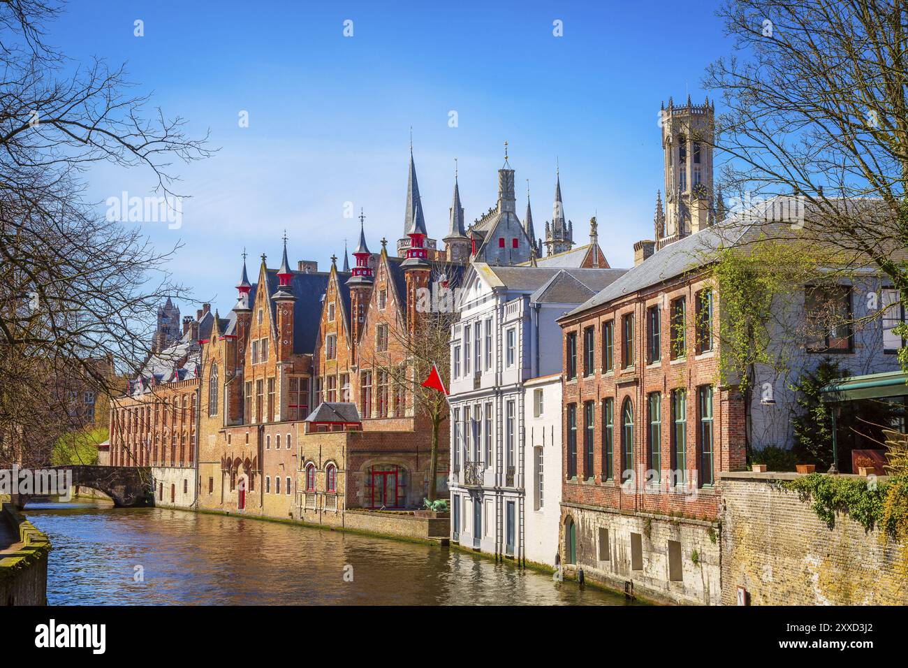 Historic medieval buildings along a canal in Bruges, Belgium, Europe ...