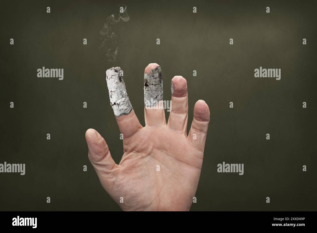 Symbolic image of a smoker with an ash finger Stock Photo - Alamy