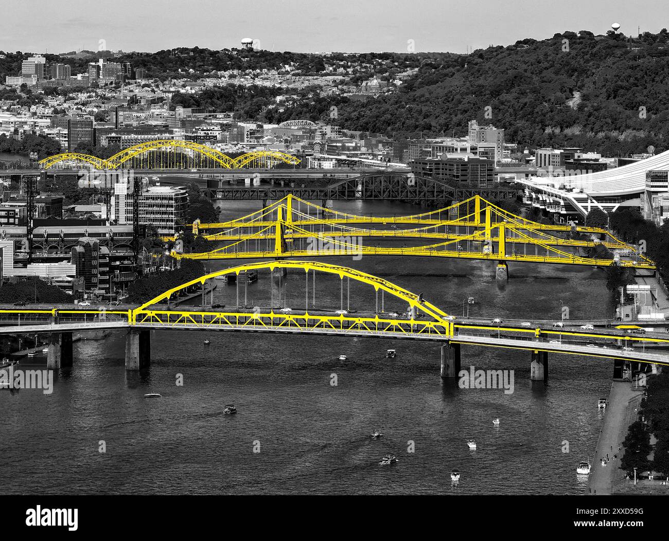 Yellow bridges span across the Allegheny River in Pittsburgh ...