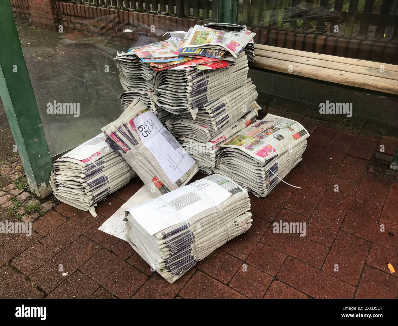 Newspaper drop-off point at a bus stop Stock Photo - Alamy