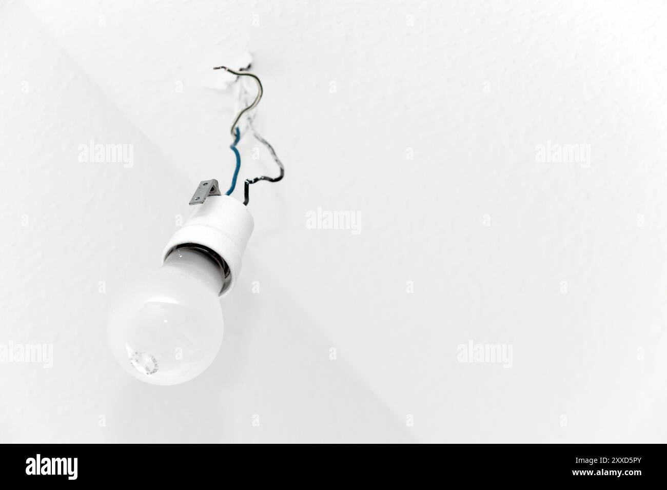 Light bulb with socket on the ceiling Stock Photo - Alamy