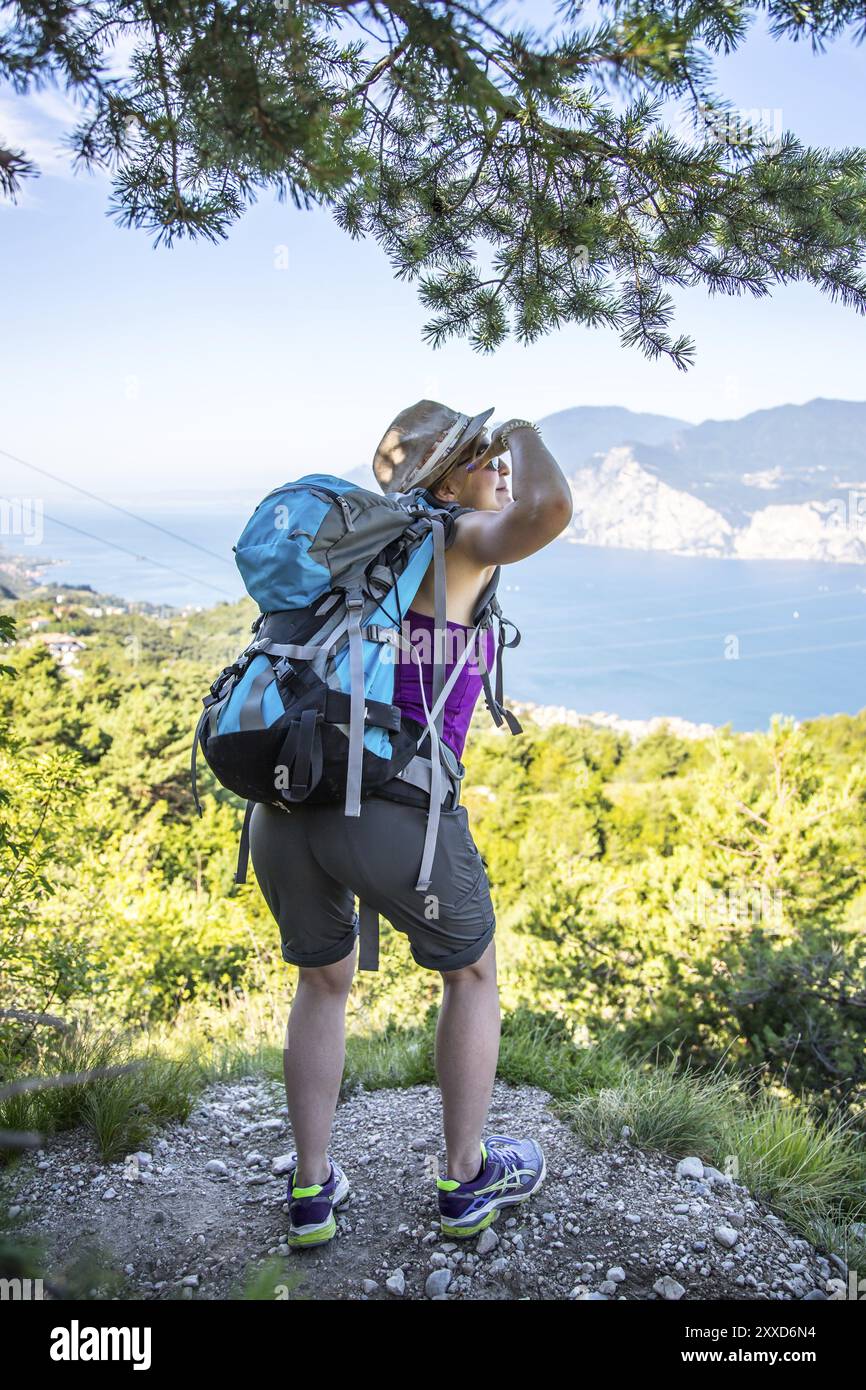 Hiking in Italy: Girl with straw hat funnily enjoying the view ...