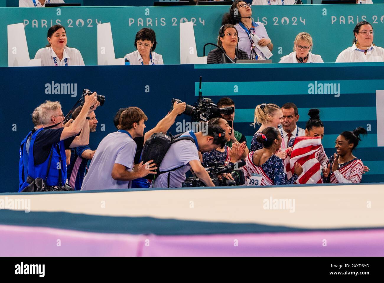 Simone Biles USA) celebrates with teammates after completing her floor ...