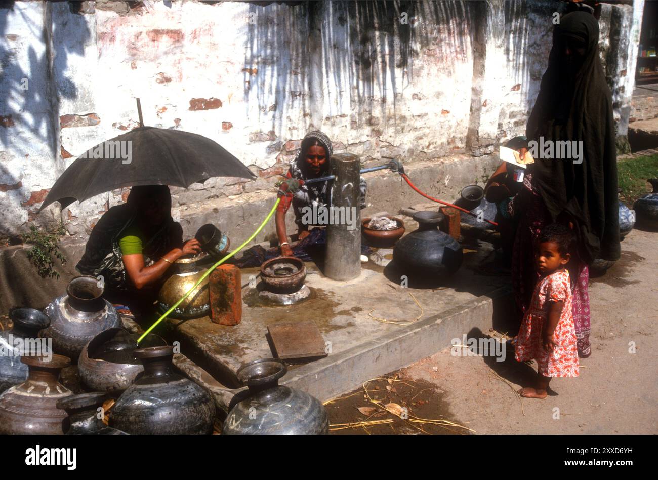 Women accessing a town water pump in Kulna, Bangladesh, 1988 Stock ...