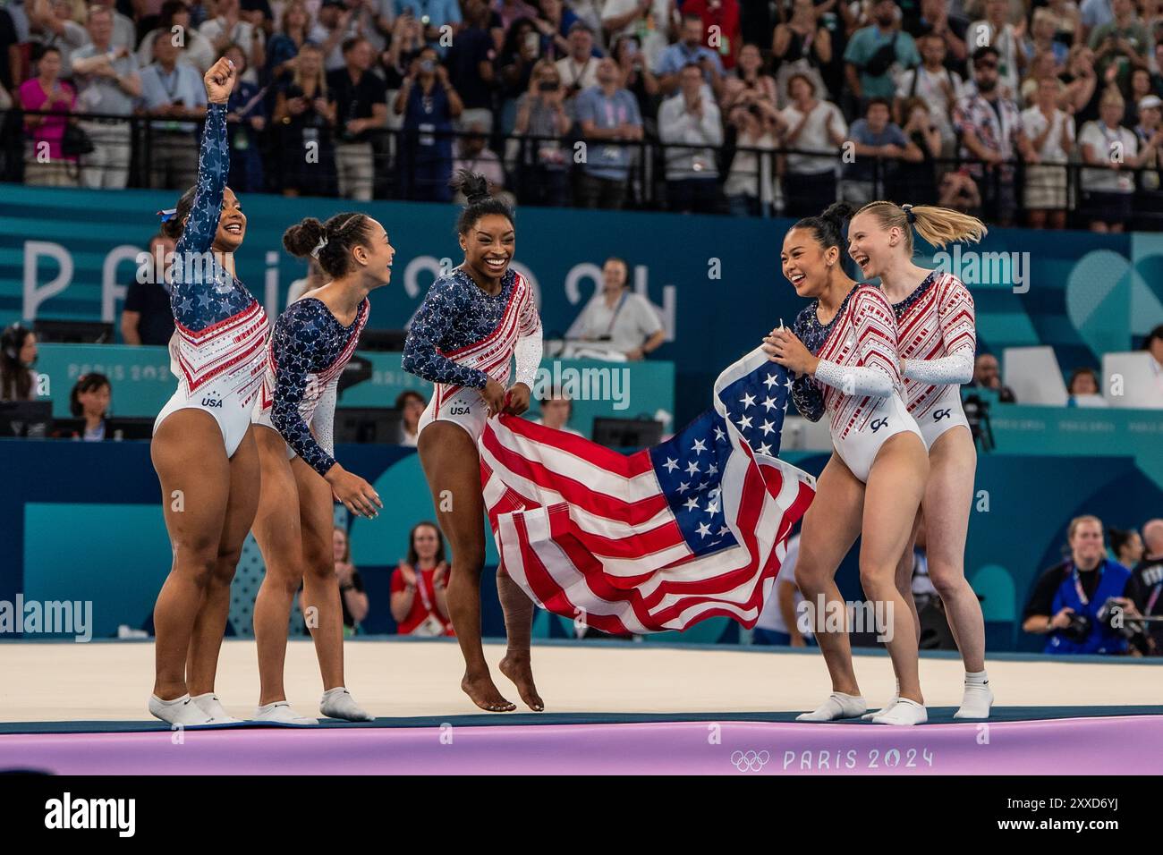 Simone Biles USA) celebrates with teammates after completing her floor ...