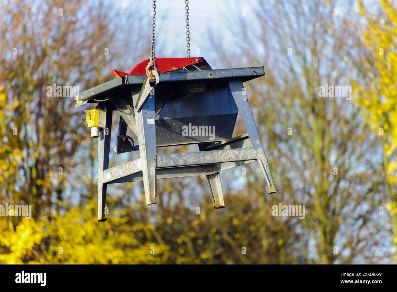 Work table for craftsmen hanging from a crane Stock Photo - Alamy