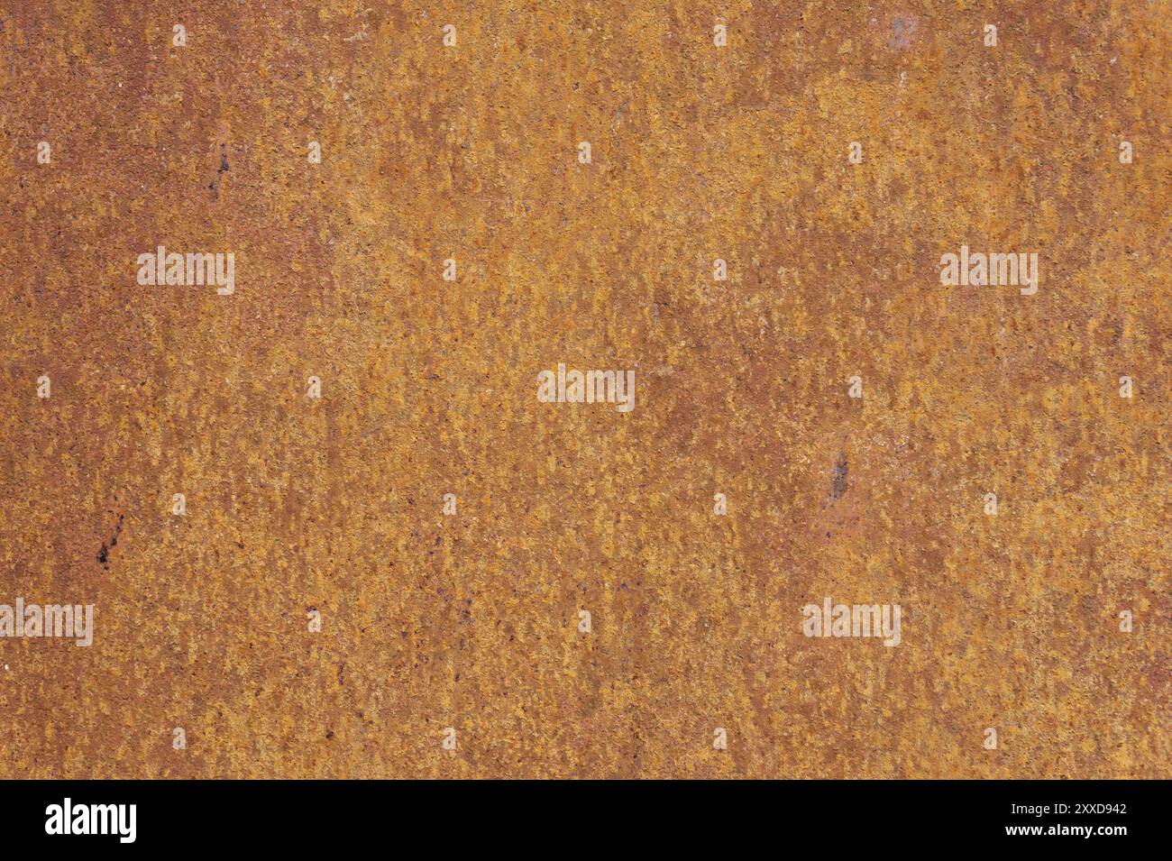 Rusty yellow-red textured metal surface. The texture of the metal sheet ...