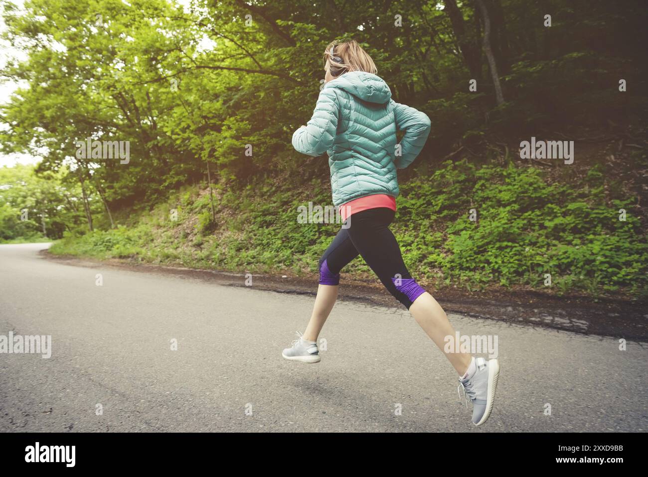 Female runner from behind hi-res stock photography and images - Alamy