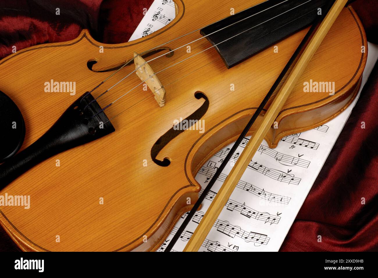 Violin and sheet music on red background musical still life Stock Photo ...