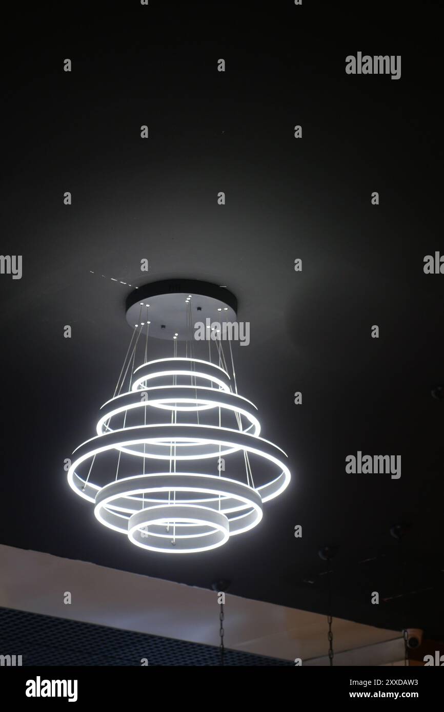 This is a stylish and modern circular LED pendant light fixture ...