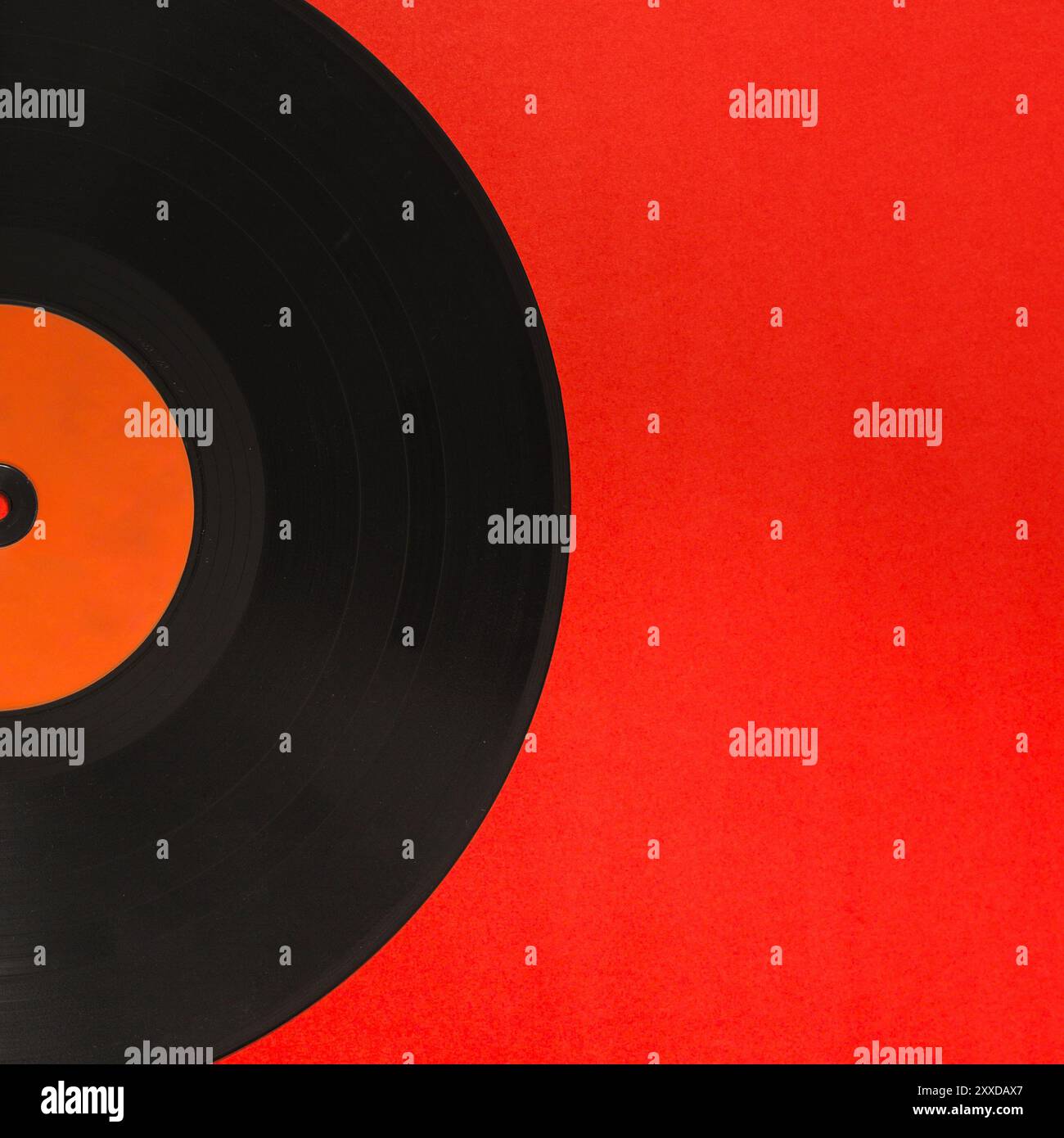 Close up vinyl record red background Stock Photo - Alamy