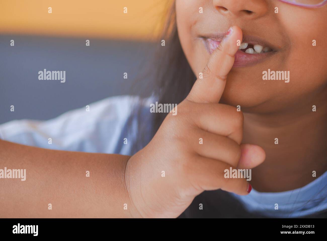 kid raising her hand indicating to stop talking or to be silent Stock ...