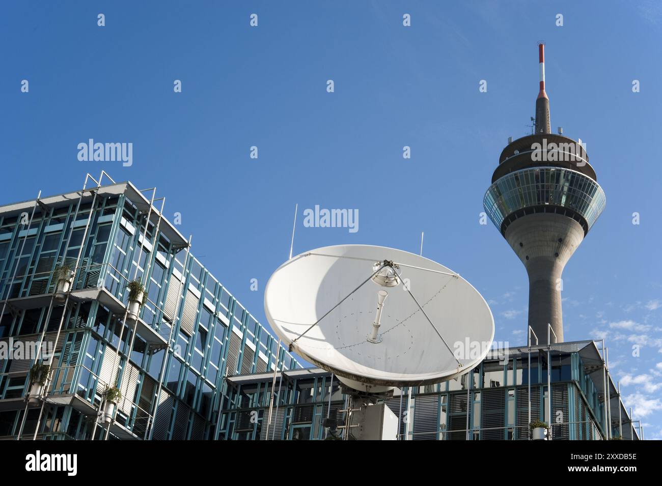 Satellite dish and television tower Stock Photo - Alamy