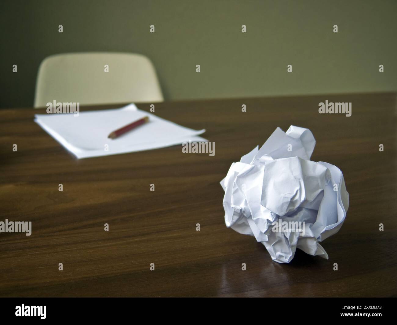 Crumpled sheet of paper on the desk Stock Photo - Alamy