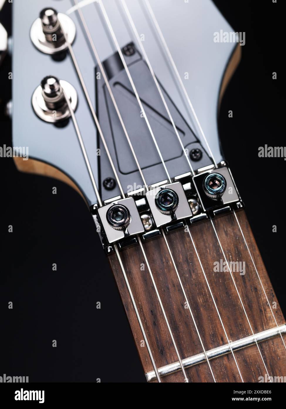 Closeup of guitar neck with string lock and locking nuts Stock Photo ...