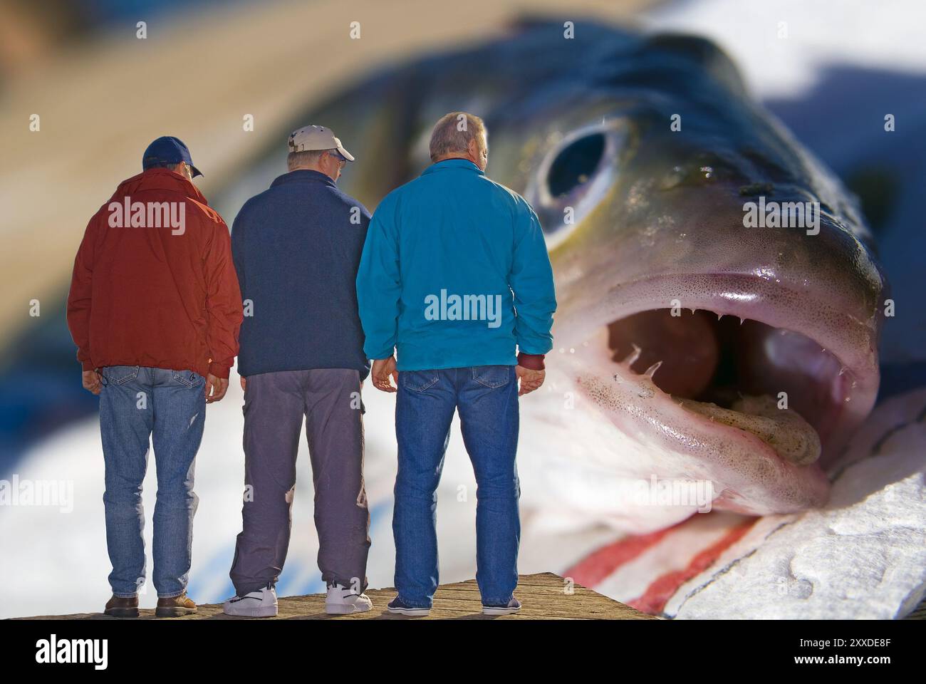 3 men and 1 fish Stock Photo - Alamy