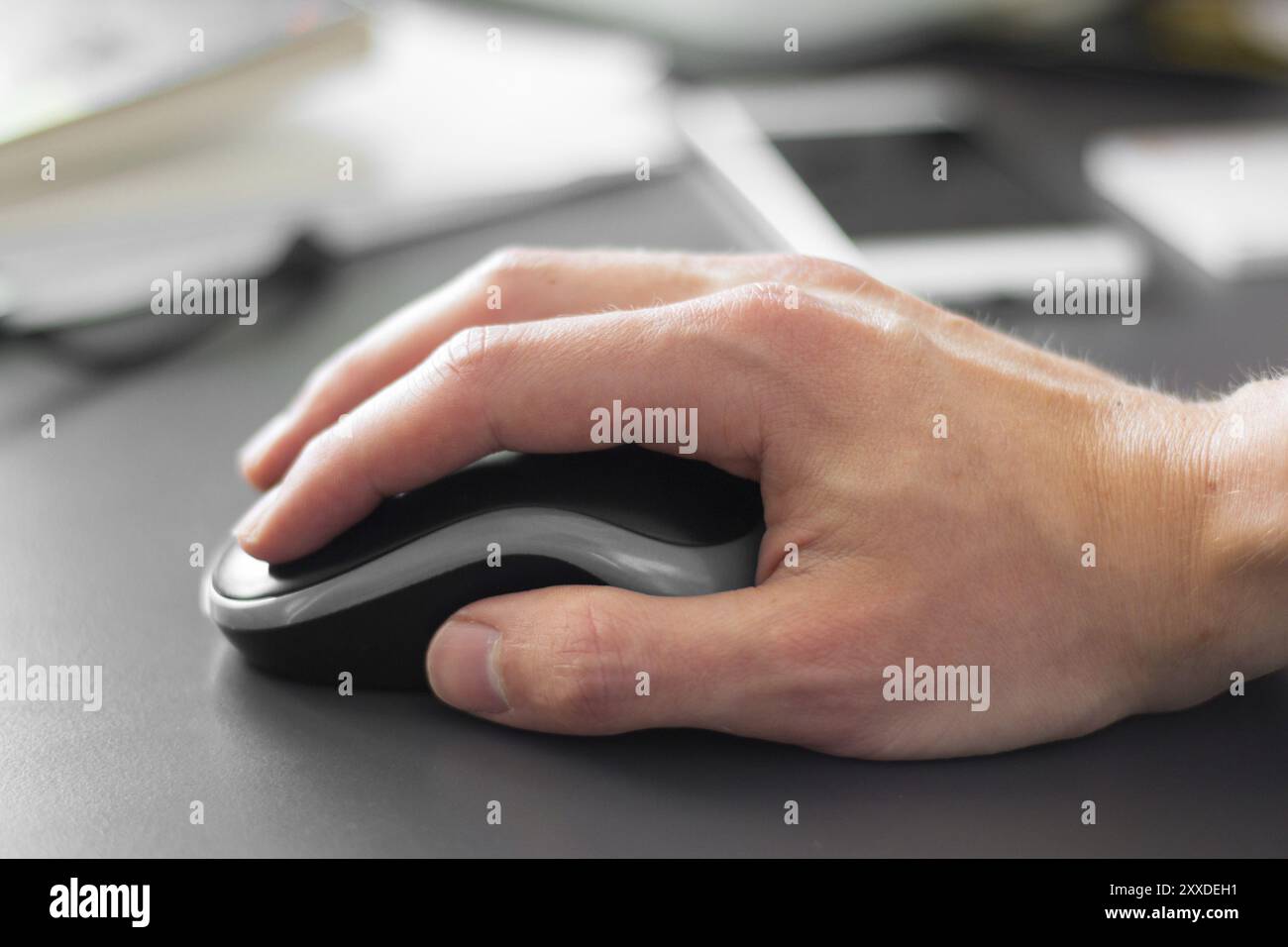 Close up of computer mouse used by a male hand Stock Photo - Alamy