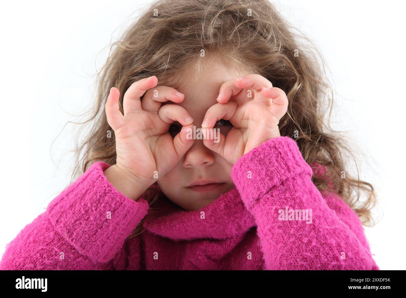Child forms hands as glasses in front of your face Stock Photo - Alamy