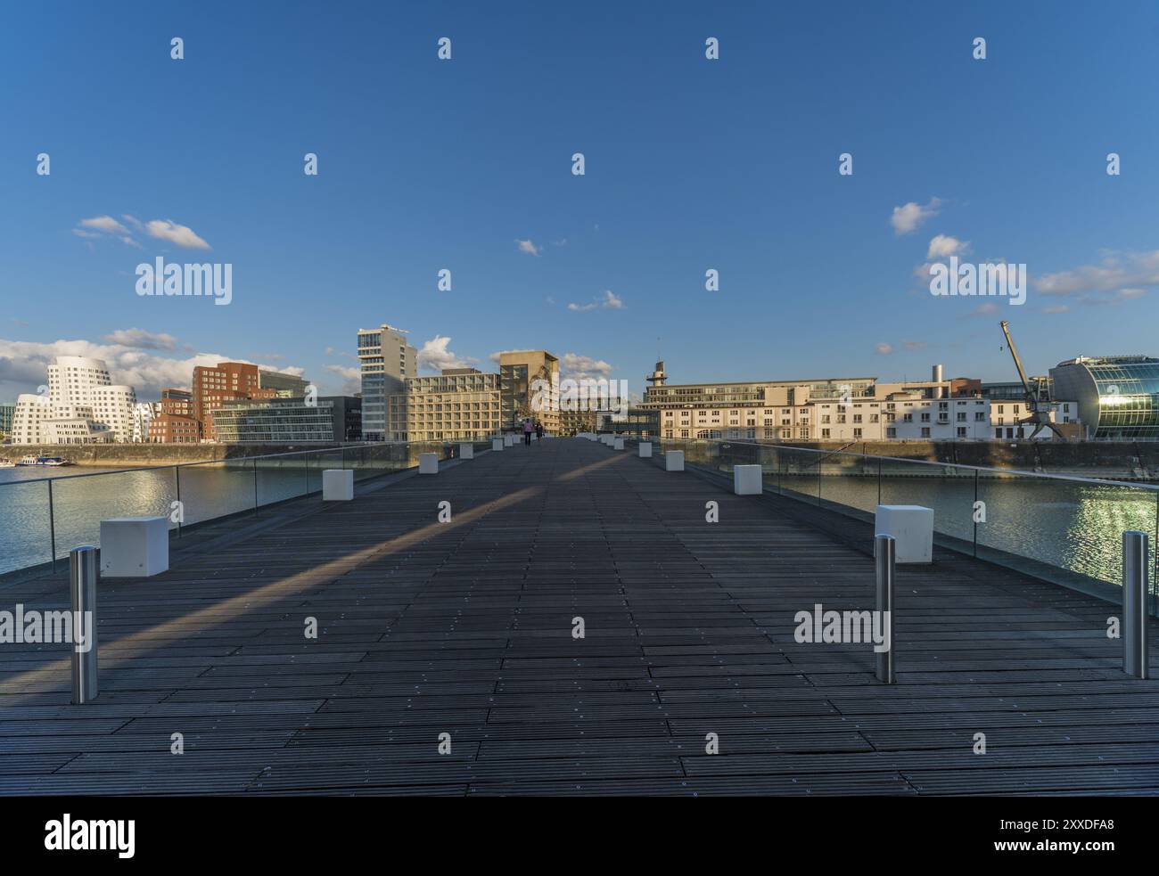 Pedestrian bridge over the harbour basin in Duesseldorf's Media Harbour ...