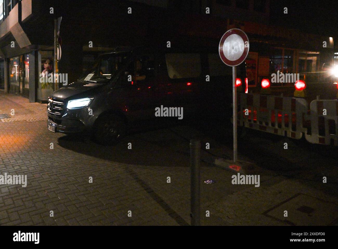 Solingen, Germany. 24th Aug, 2024. A hearse drives away from the scene ...