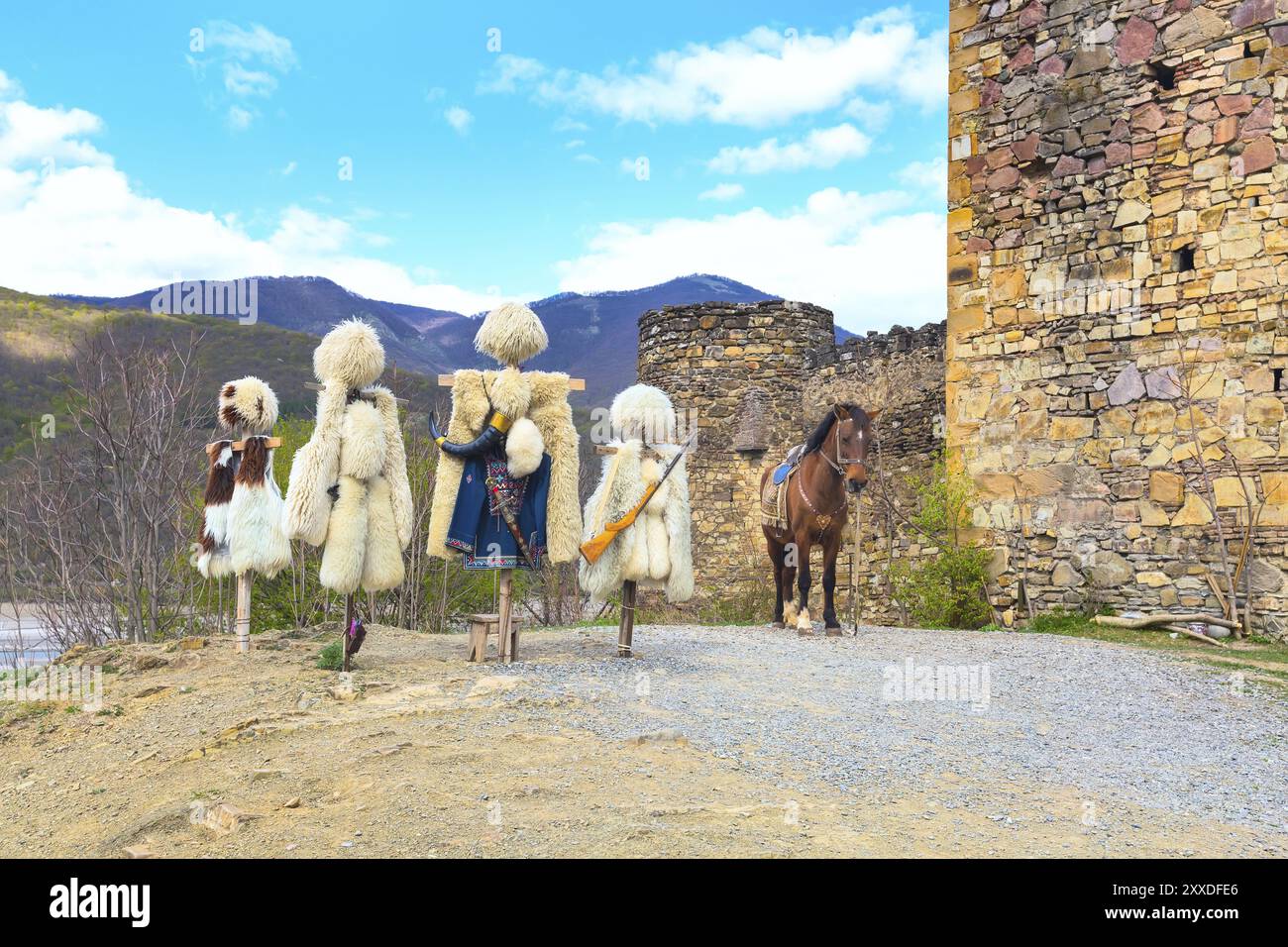 Traditional Georgian shepherd dress, hat or papakha and coat of sheep ...