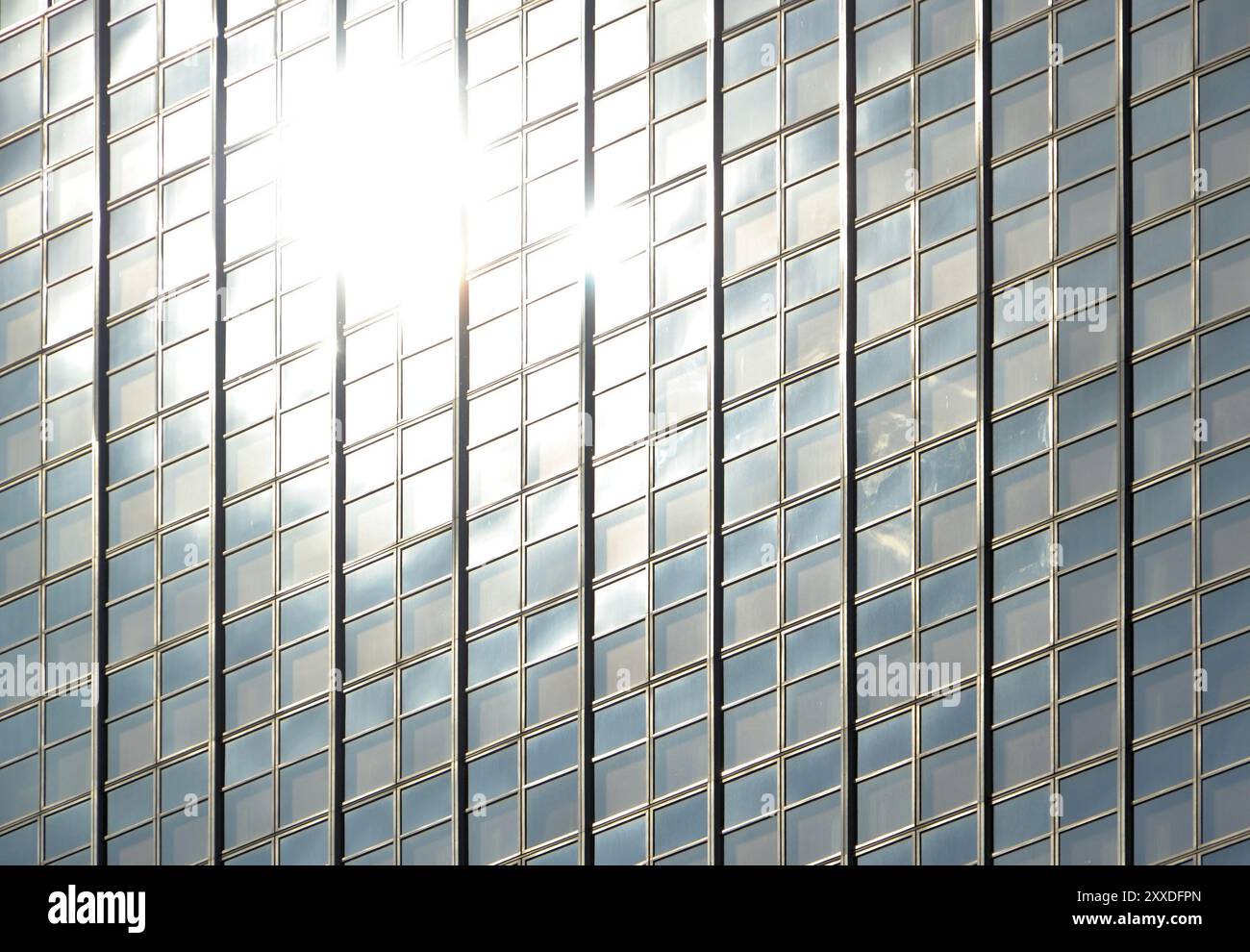 Reflection of the sun in the glass facade of an office building Stock ...