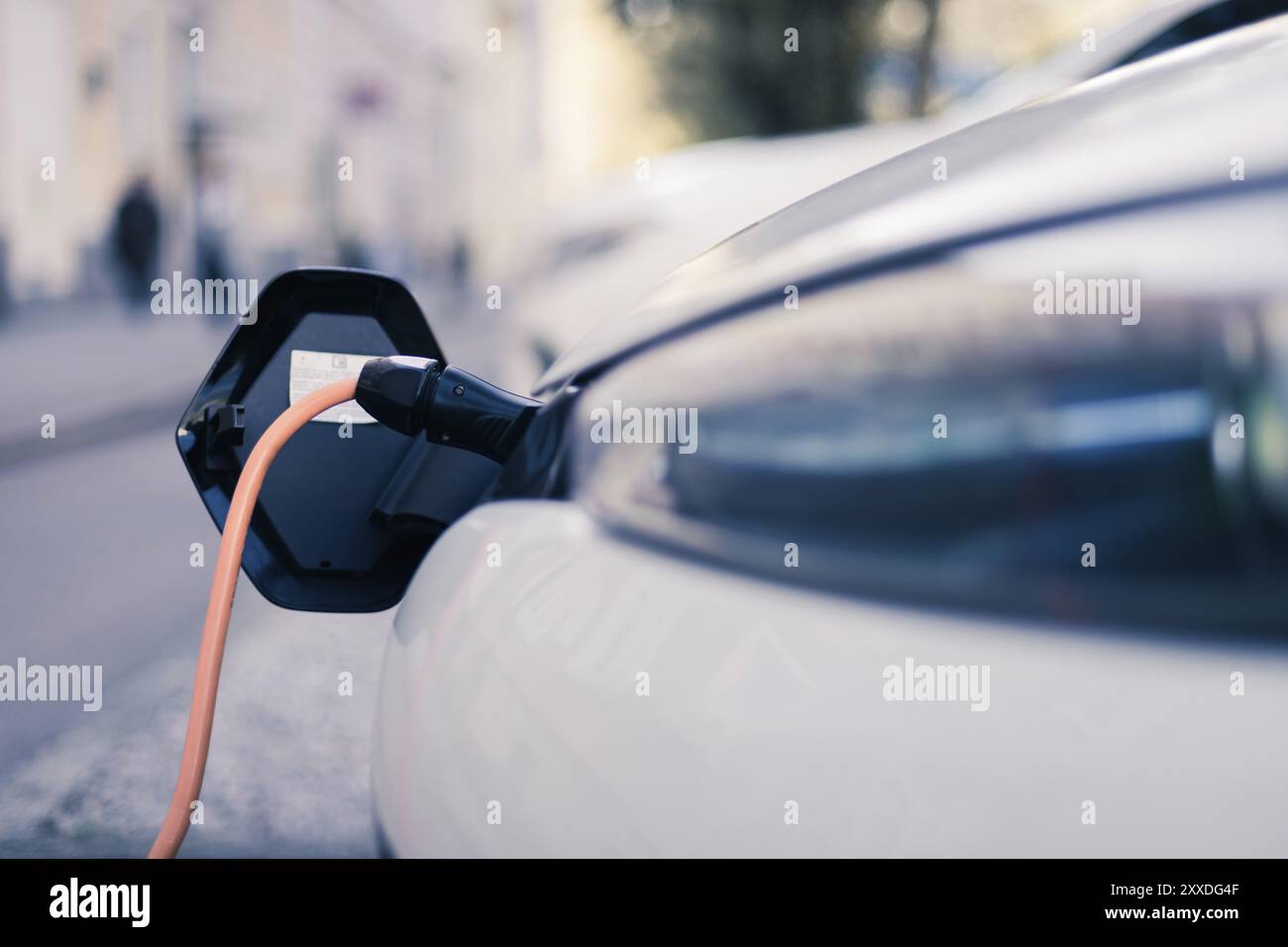 Electric car recharging with charge cable and plug leading to charge ...
