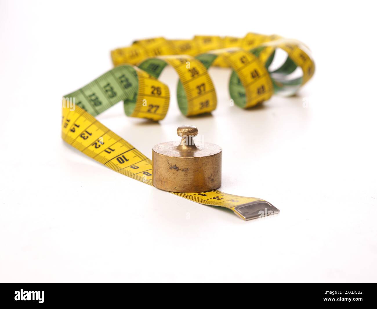 Diet or weight gain concept image with a measuring tabe, isolated on ...