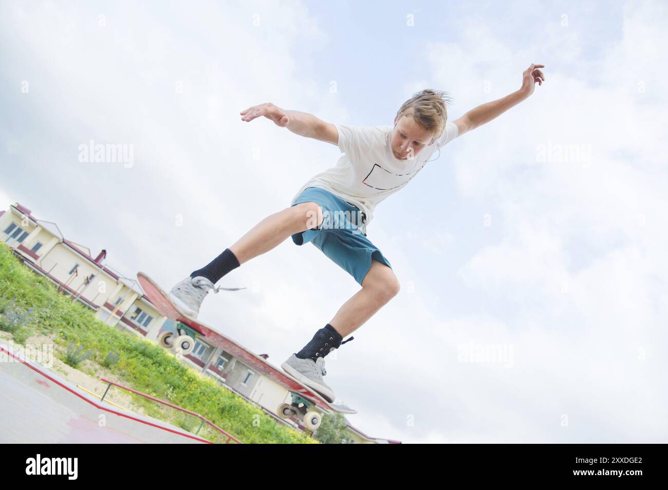 Young intense skateboarder in high jump against the sky and sleeping ...
