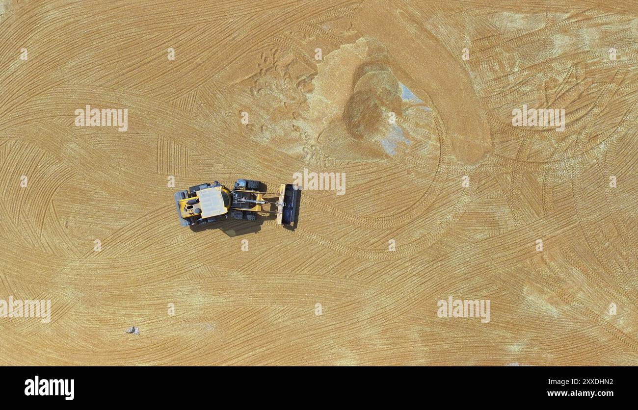 Aerial photo shows farmers drying wheat in Zhangye City, northwest ...