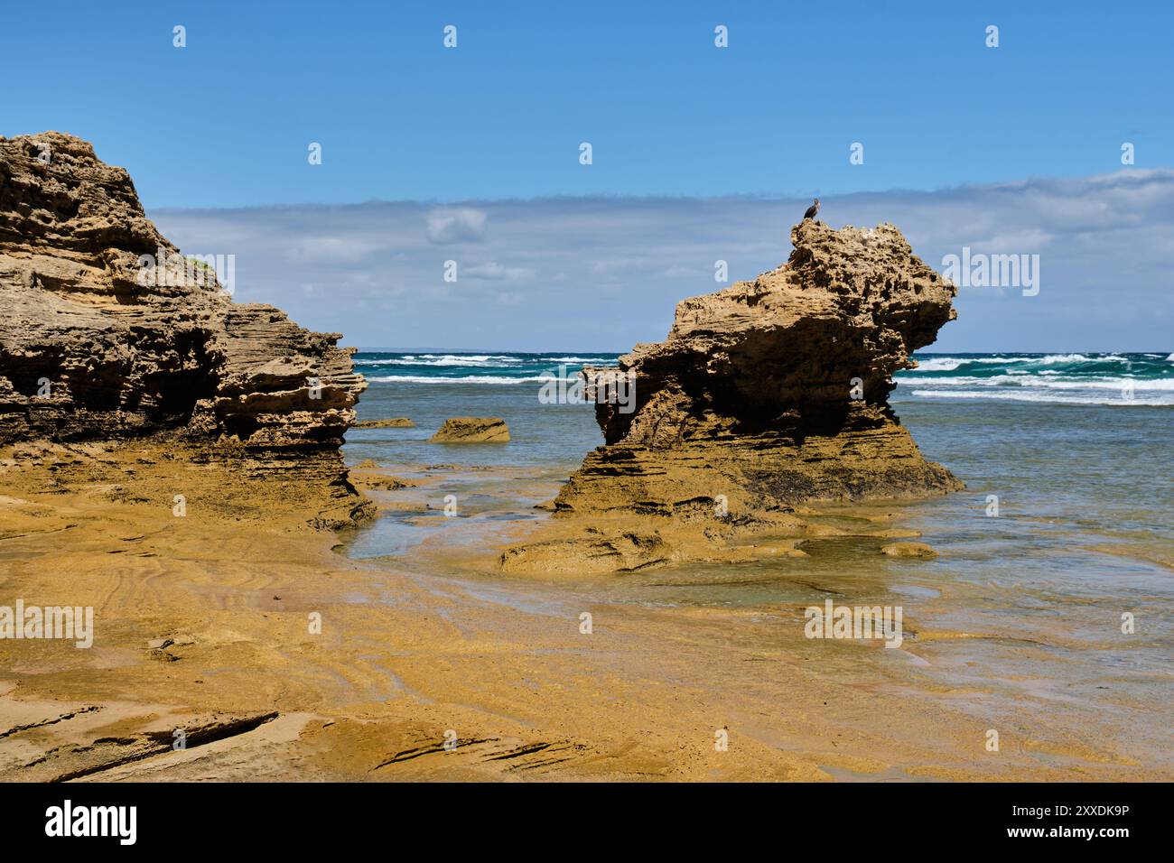 Sculptured sandstone rock formations on the beach below the lighthouse ...