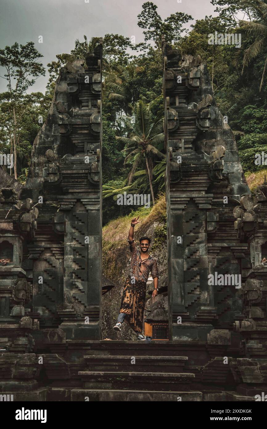 Backpacker in historic temple in Ubud, Bali Stock Photo - Alamy