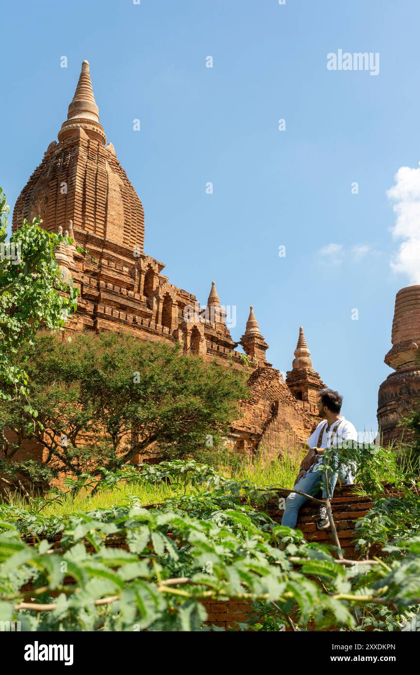 Traveler exploring the Bagan temples amidst trees Stock Photo - Alamy