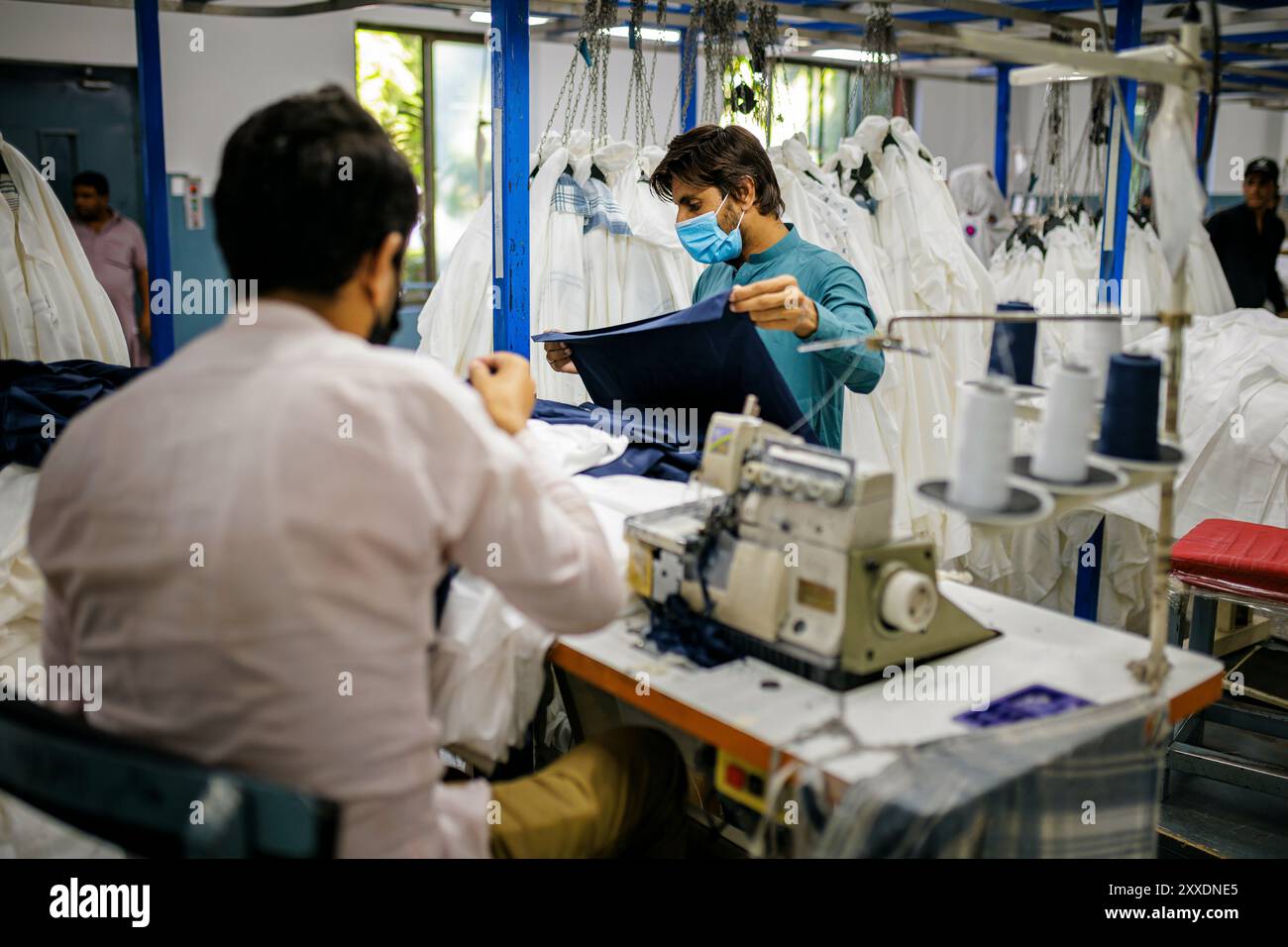 Islamabad, Pakistan. 21st Aug, 2024. Workers in the textile factory ...