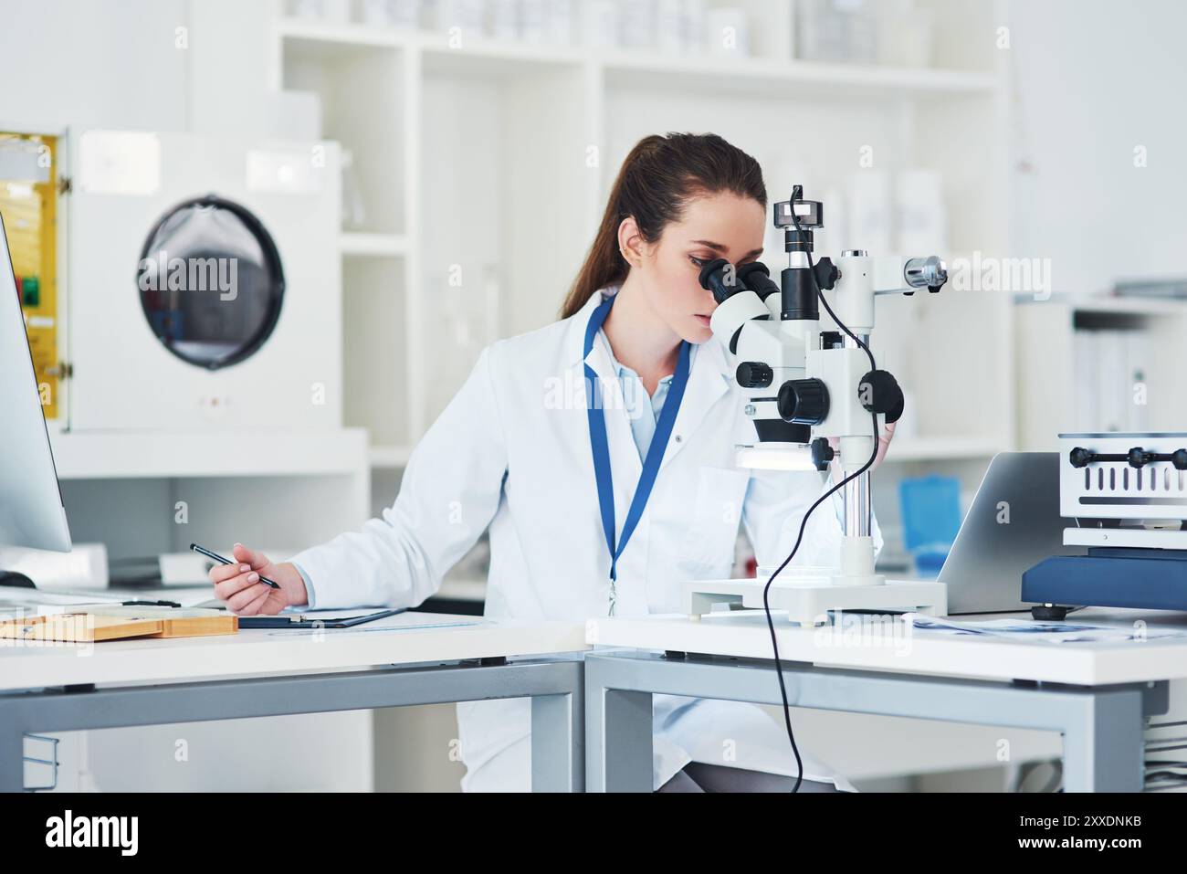 Microscope, woman and scientist in medical research in science lab for ...