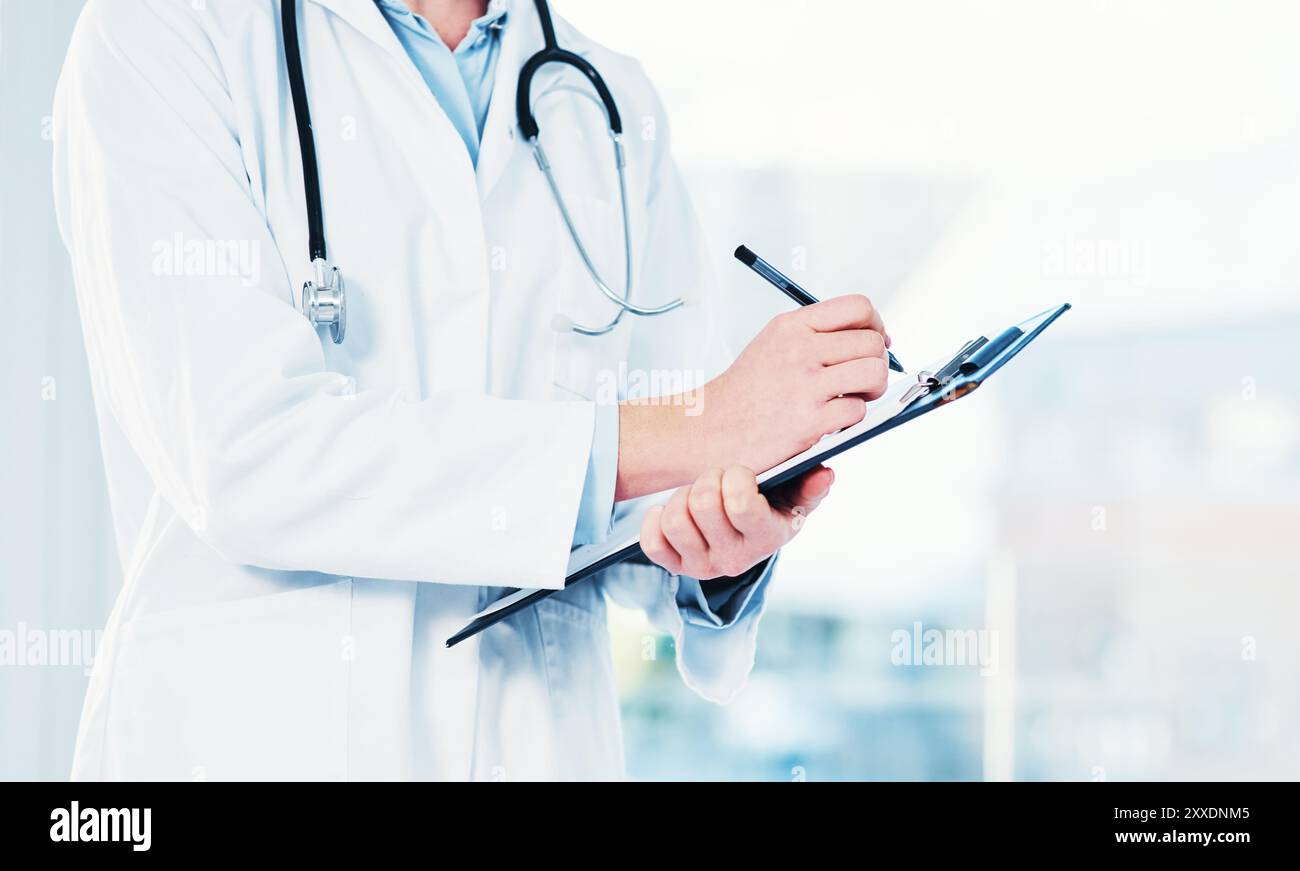 Hands, doctor and clipboard writing notes for hospital schedule ...