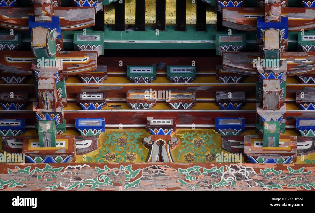 Antique wood carvings in deep relief painted in rich colors on the ...