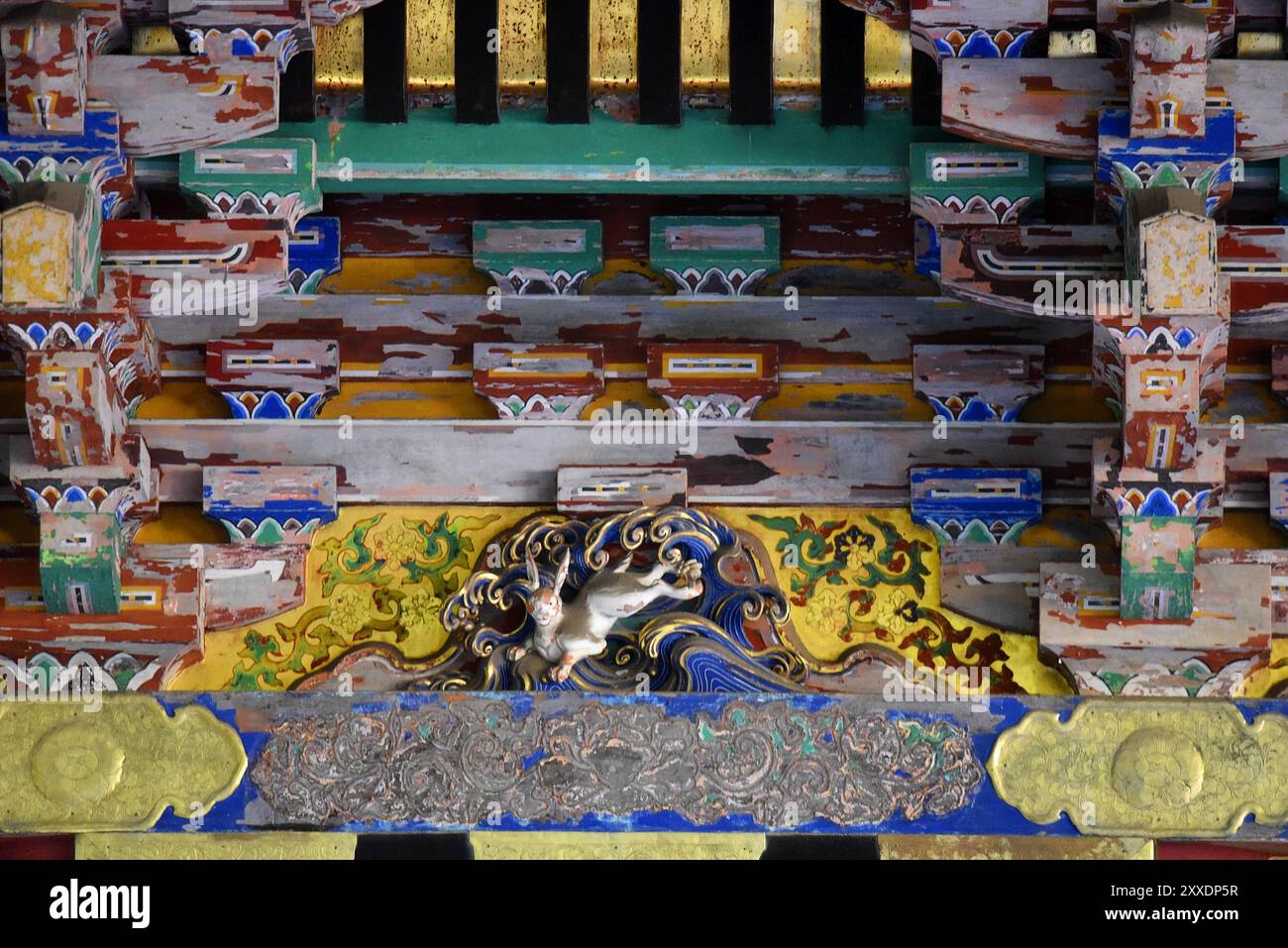 Antique wood carvings in deep relief painted in rich colors on the ...