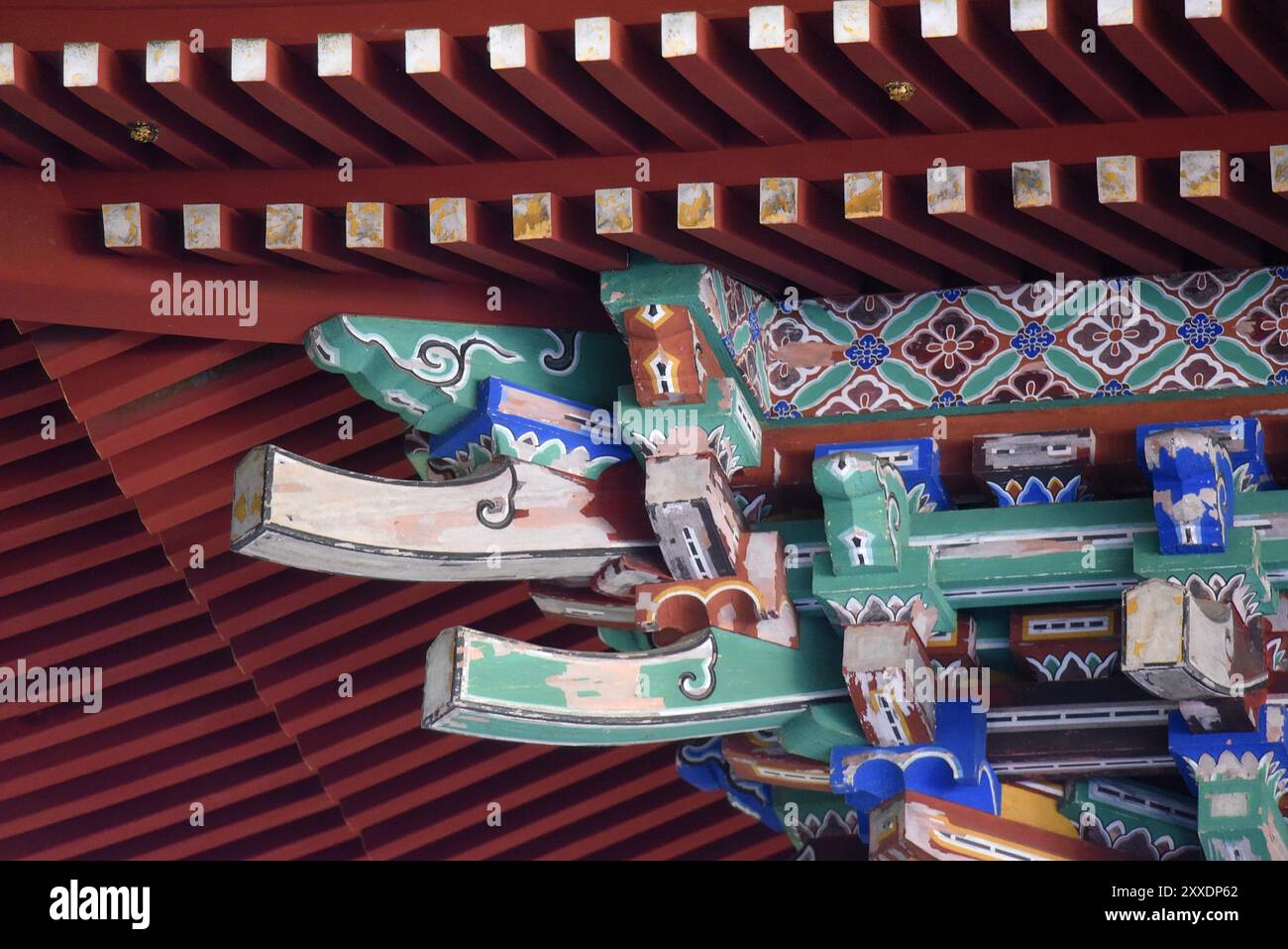 Antique wood carvings in deep relief painted in rich colors on the ...