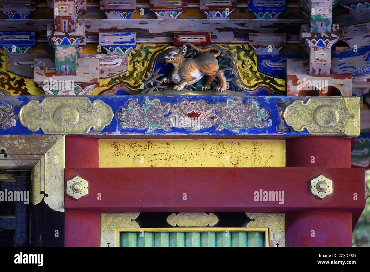 Antique wood carvings in deep relief painted in rich colors on the ...