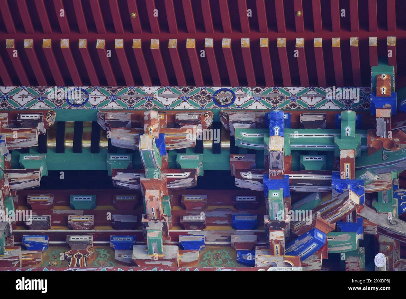 Antique wood carvings in deep relief painted in rich colors on the ...