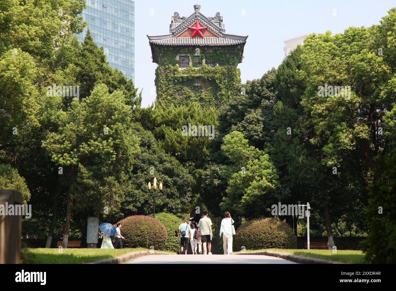 People walk to the iconic North Tower on the Gulou campus of Nanjing ...