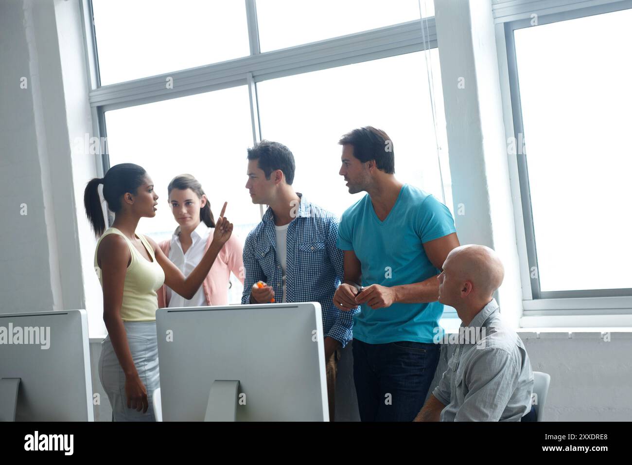 Computer, conflict and business people in office for meeting, problem ...