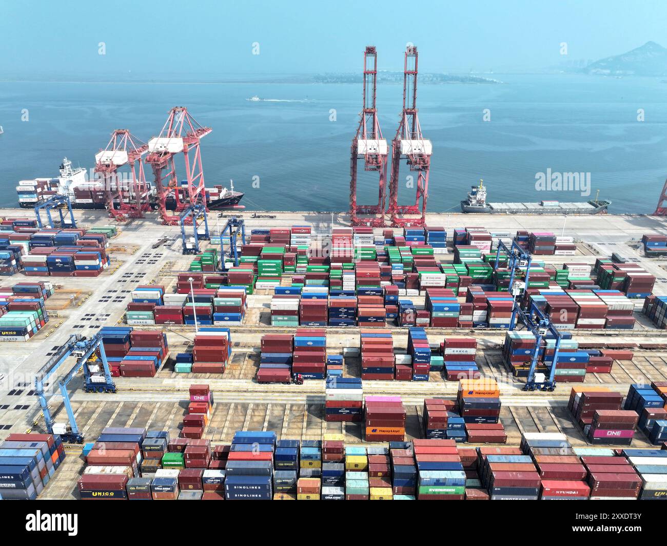 LIANYUNGANG, CHINA - AUGUST 24, 2024 - Cargo ships load and unload ...