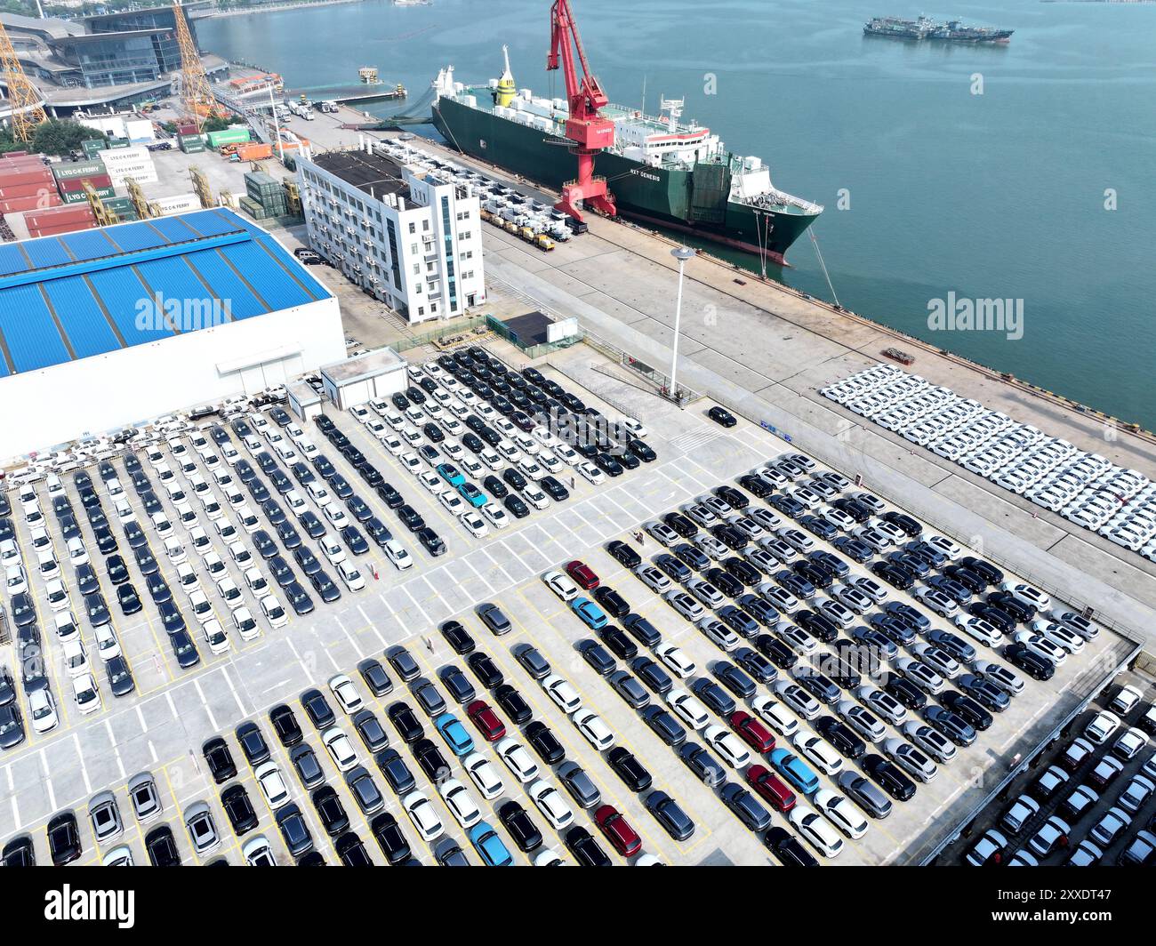 LIANYUNGANG, CHINA - AUGUST 24, 2024 - Cargo ships load and unload ...