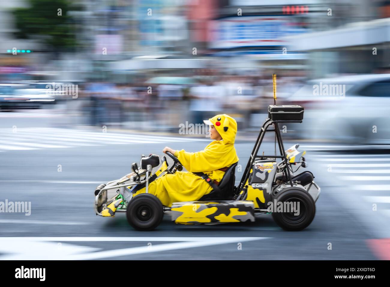 A Tourist dressed as the famous Pokemon Pikachu drives a Go-Kart on the ...