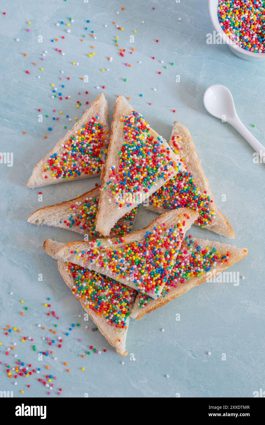 Slices of fairy bread which is a traditional Australian party food Stock Photo - Alamy